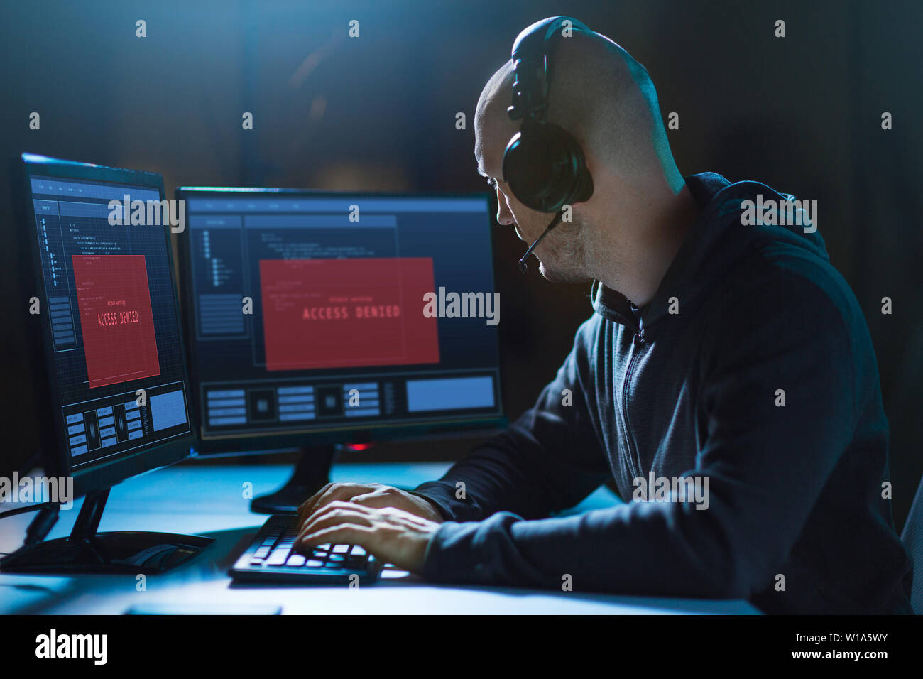 hacker with access denied messages on computers Stock Photo - Alamy