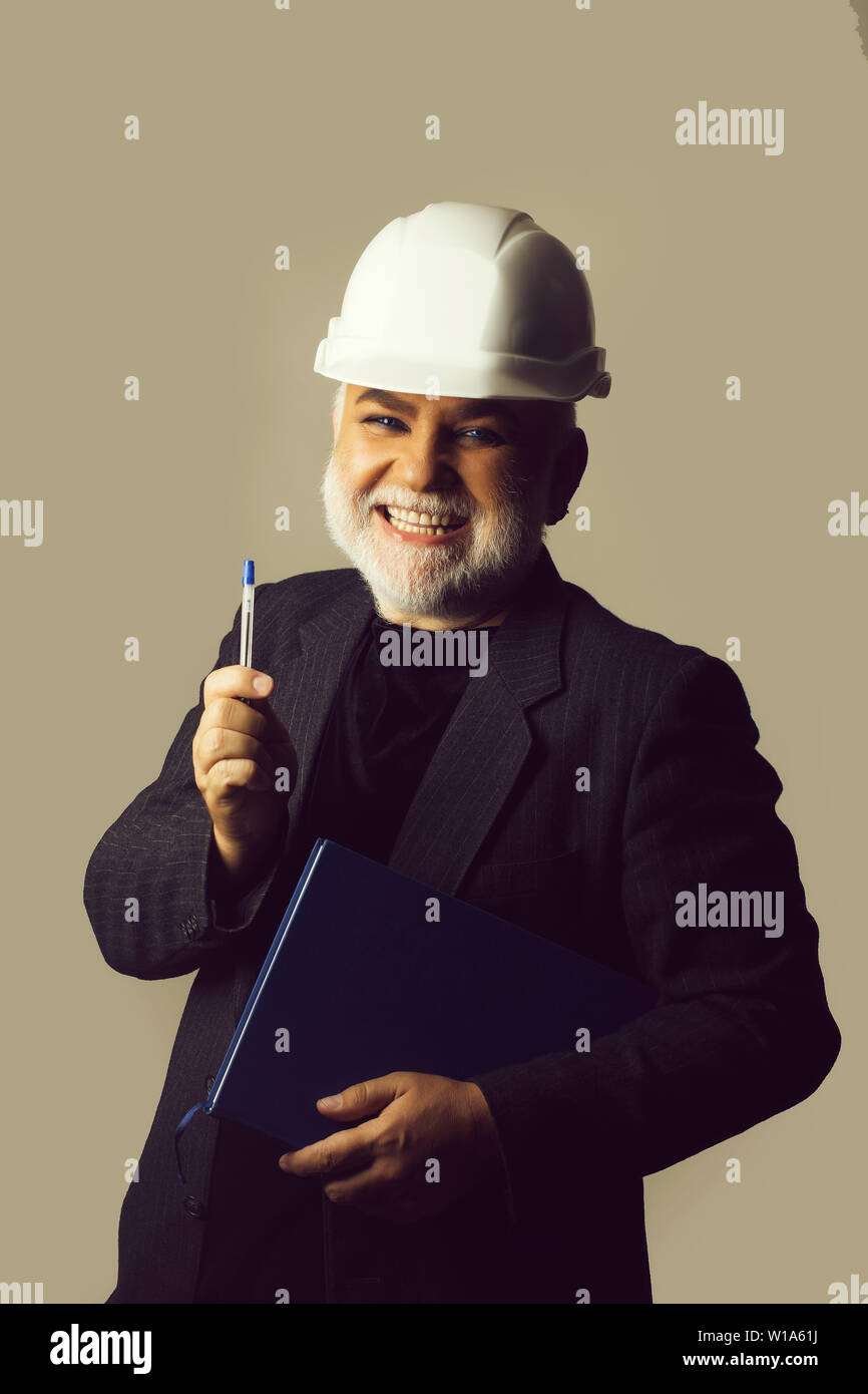 Man in hard hat smiles Stock Photo - Alamy