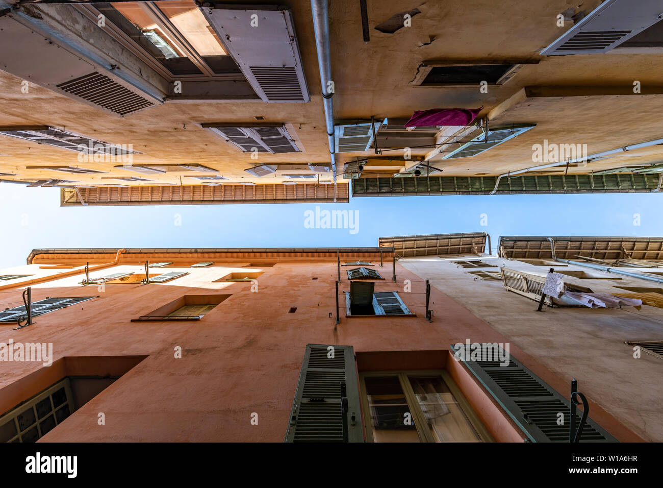 dynamic view from down to up of buildings, Old town of Nice, France ...