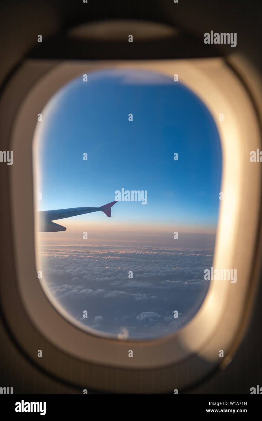 The window of the airplane. A view of porthole window on board an ...