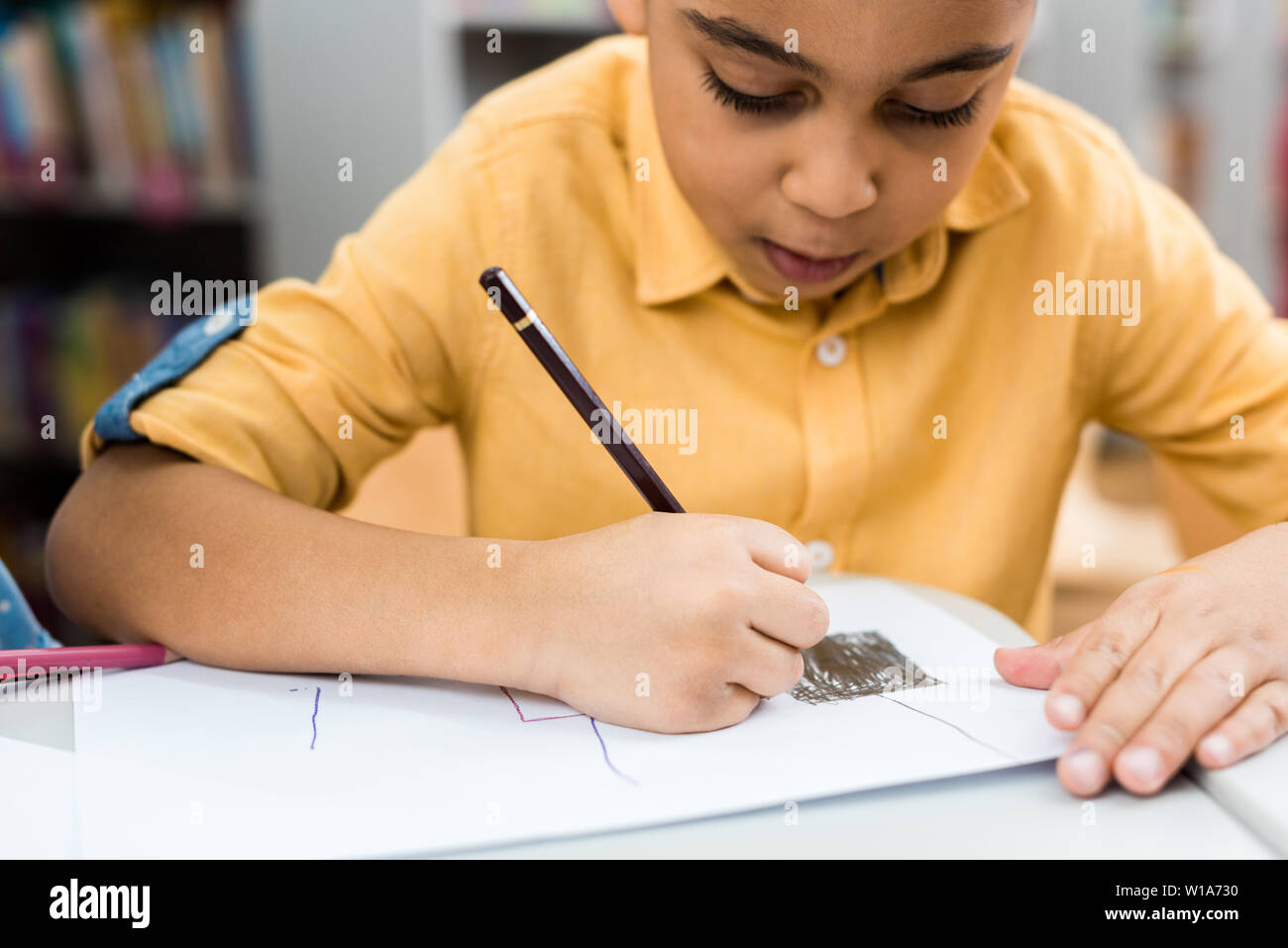 selective focus of cute african american kid drawing with pencil Stock ...