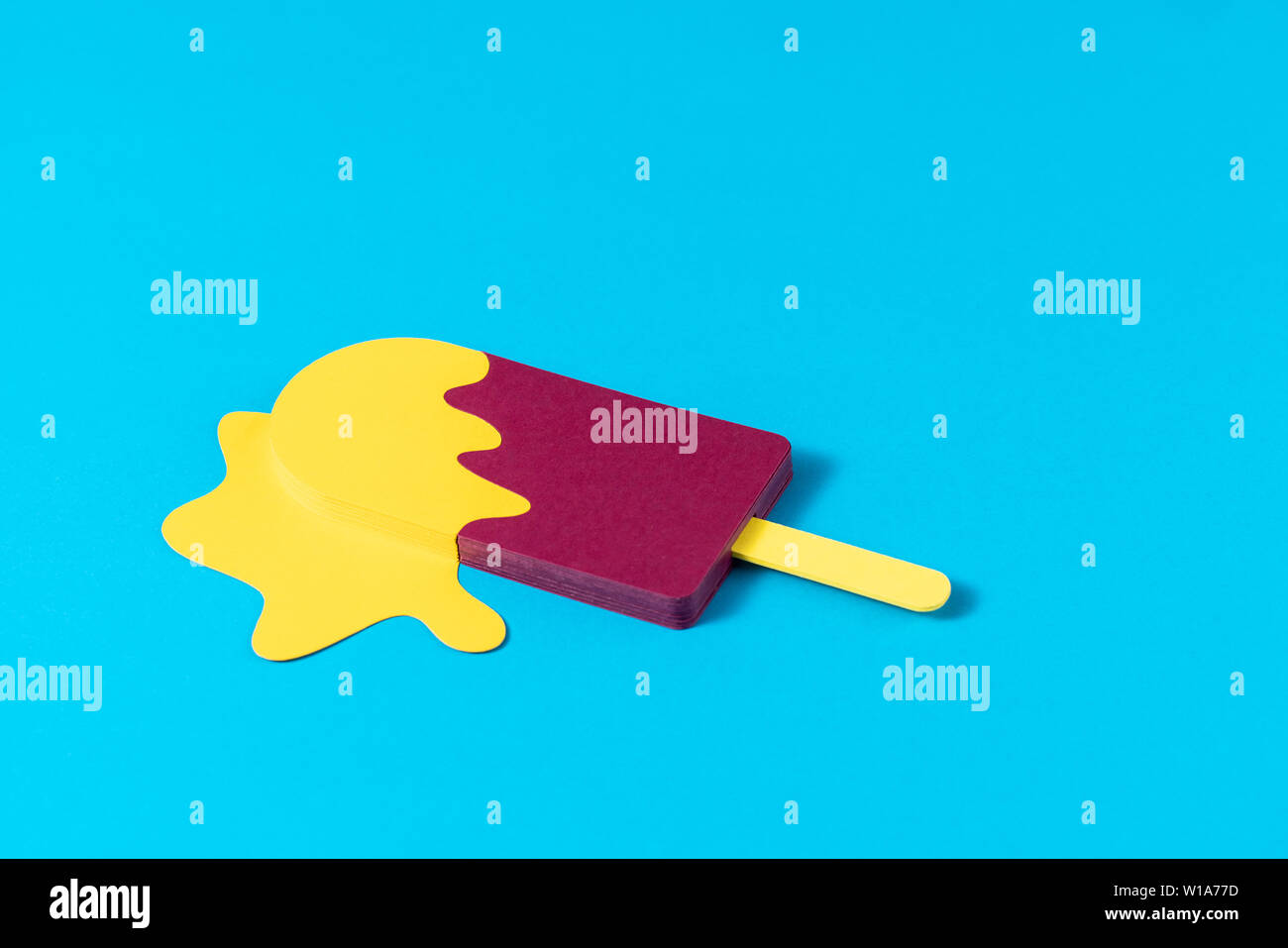 Colorful paper marsala ice cream with an yellow stick and streaks on ...