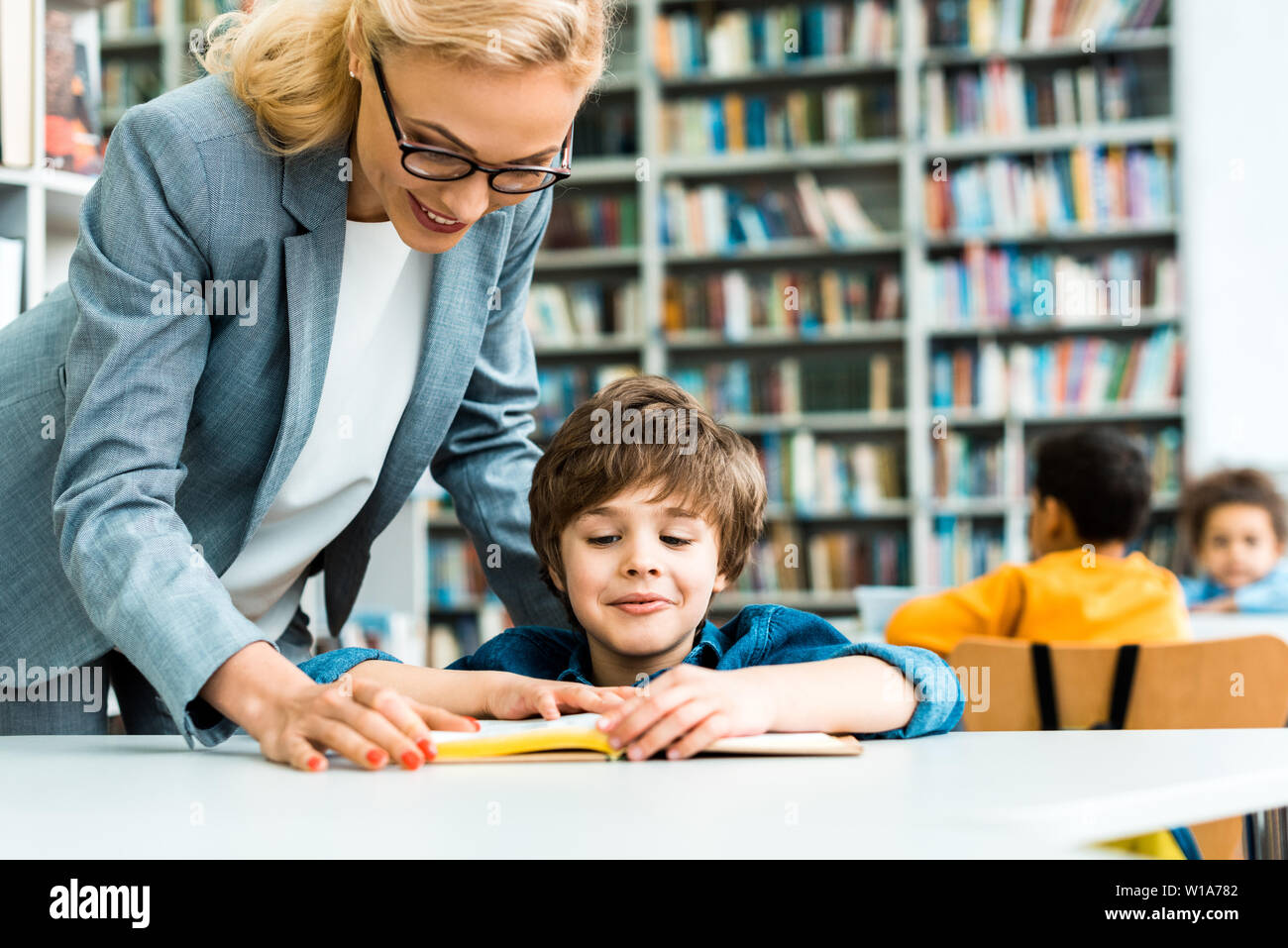 Child standing reading book hi-res stock photography and images - Alamy