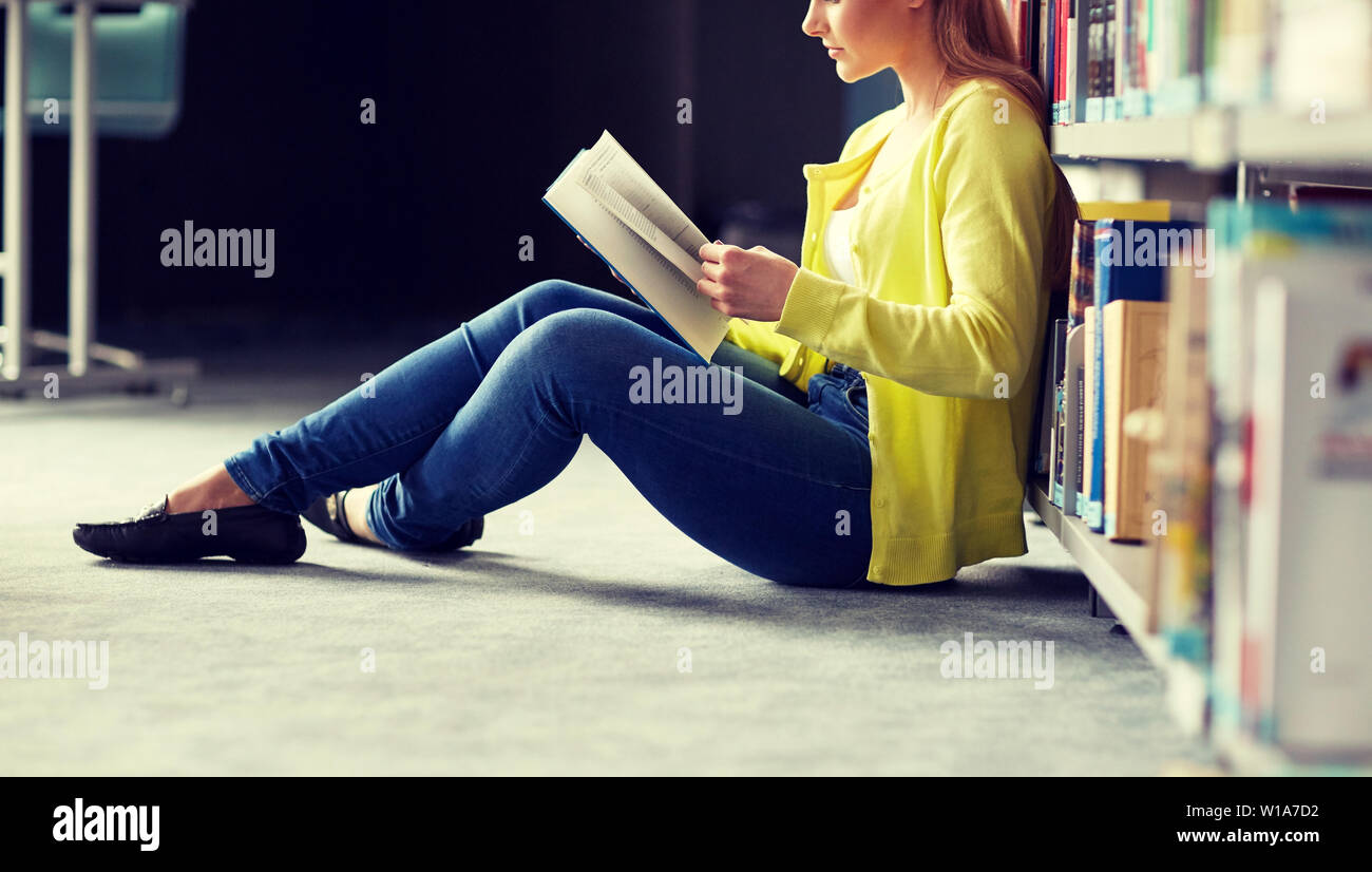 high school student girl reading book at library Stock Photo - Alamy