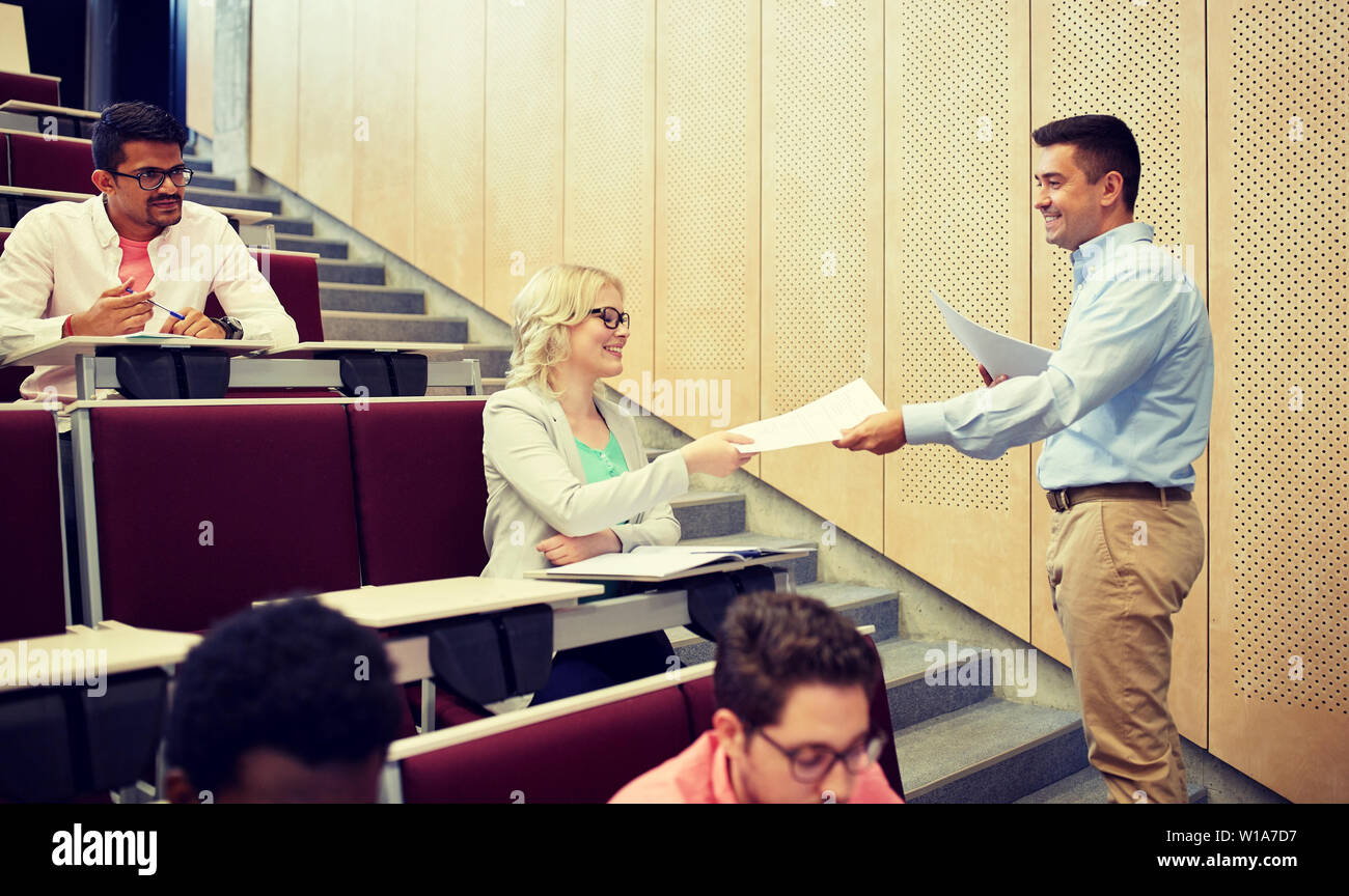 teacher giving tests to students at lecture Stock Photo - Alamy