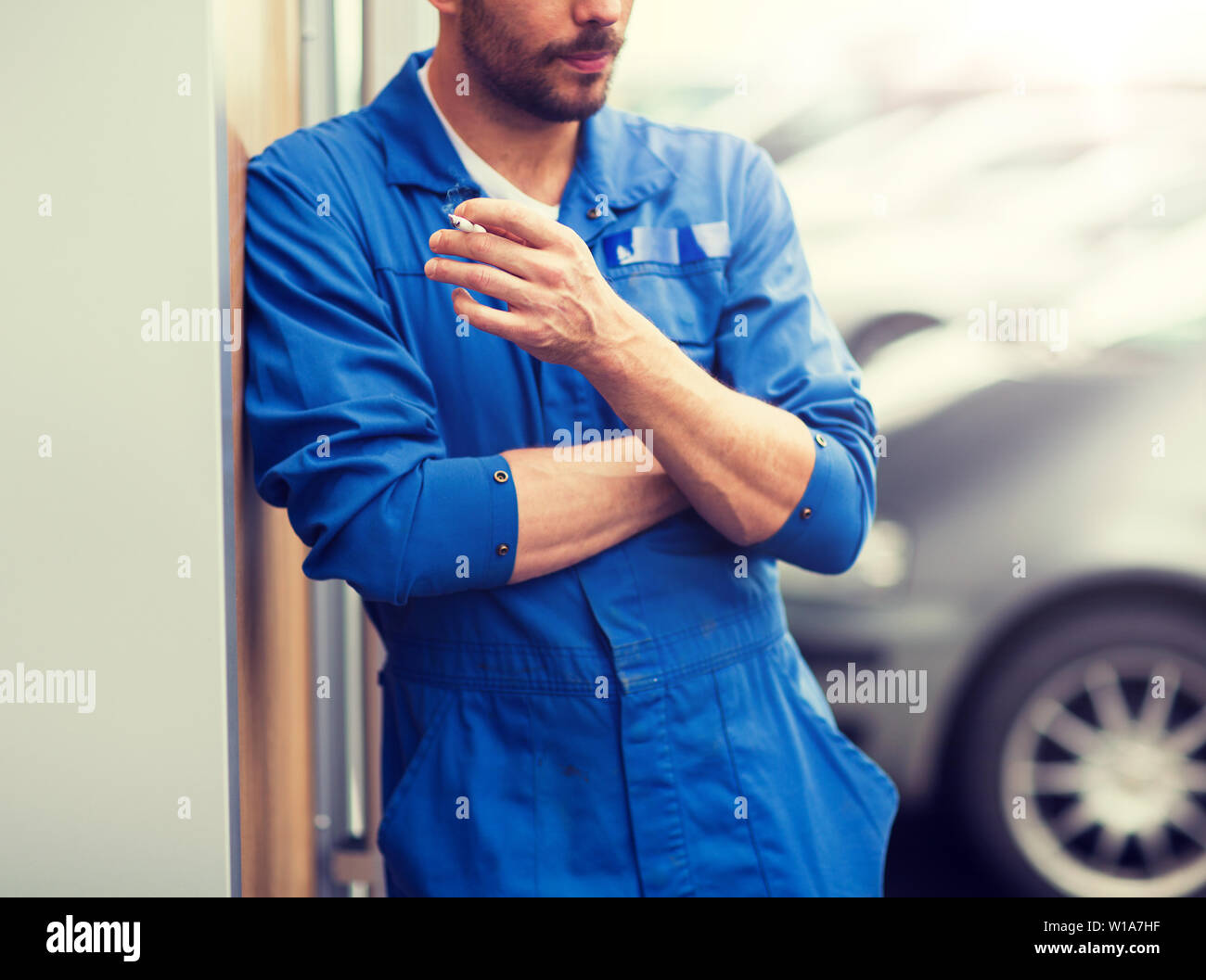 close up of auto mechanic smoking cigarette Stock Photo - Alamy