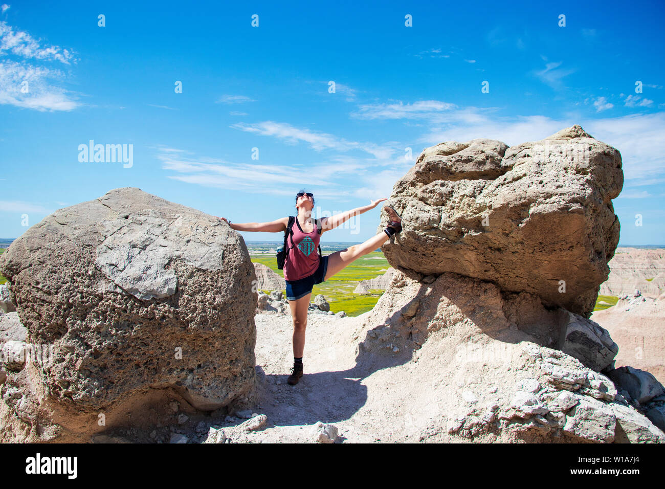Woman Posing between two Rocks Stock Photo - Alamy