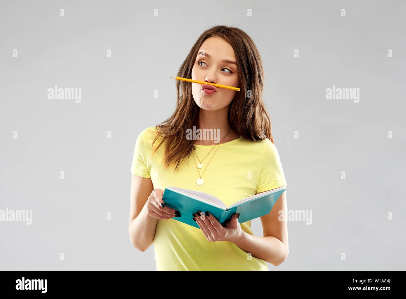 teenage student girl with notebook and pencil Stock Photo - Alamy