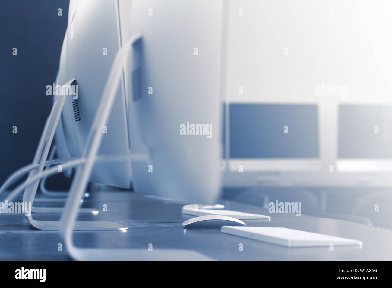 perspective closeup view of keyboards workstation computers and mouse ...