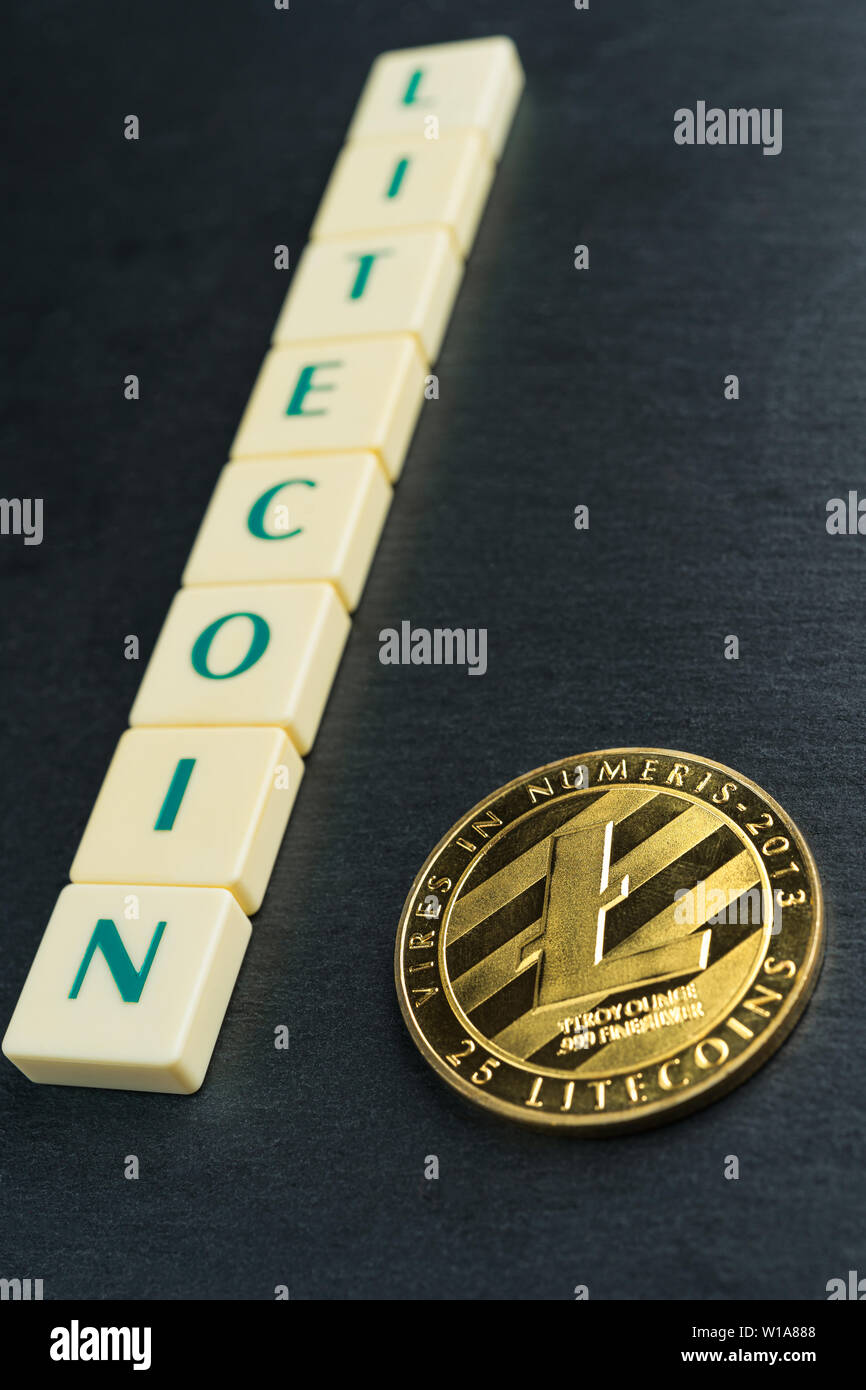 Physical Litecoin gold coin with text made out of letter tiles ...