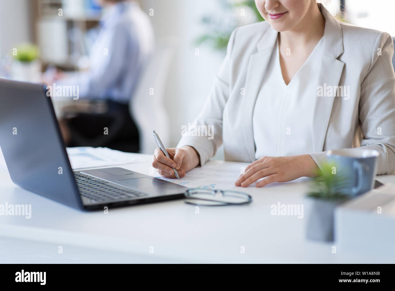 Woman working reading papers hi-res stock photography and images - Alamy