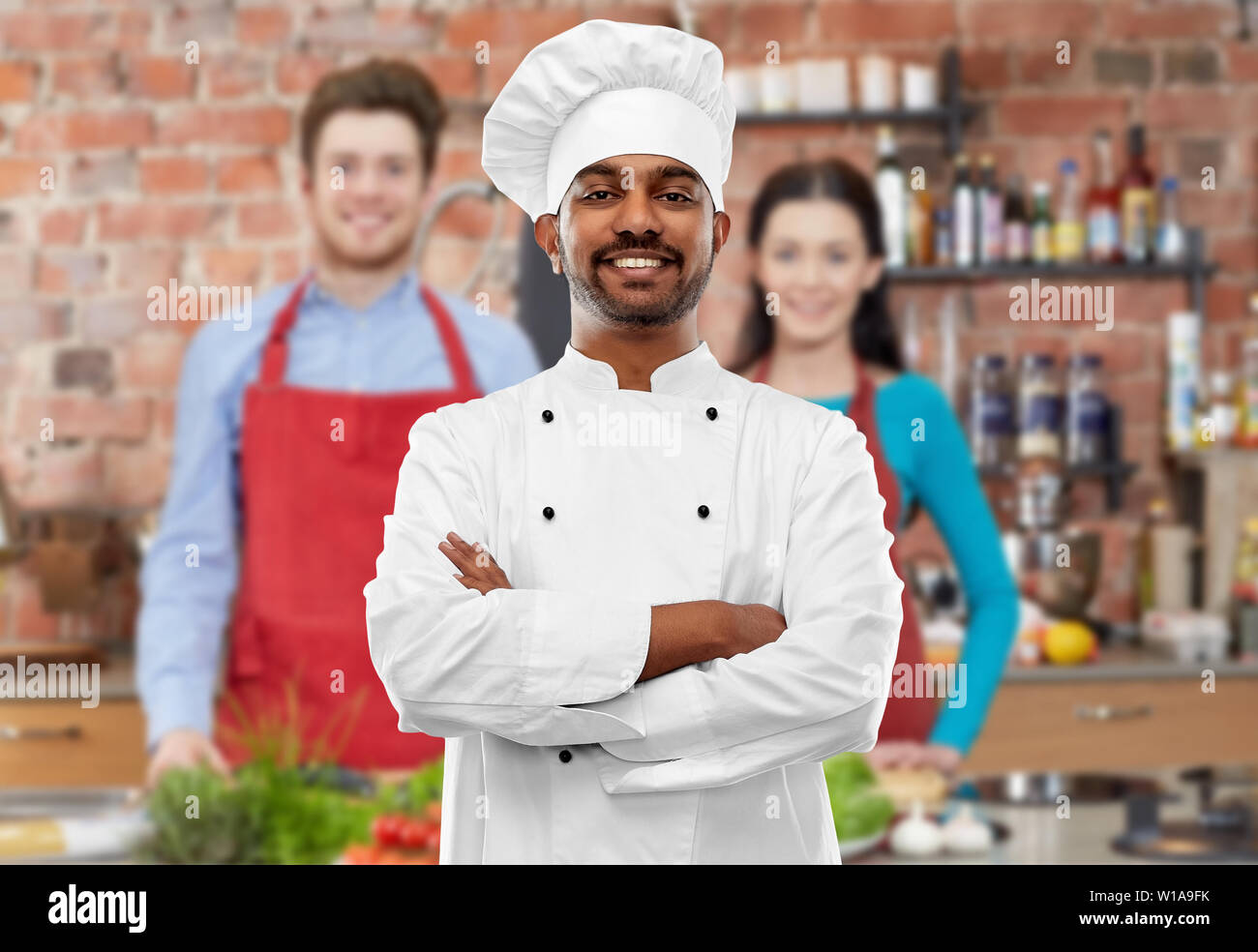 happy male indian chef in toque at cooking class Stock Photo - Alamy