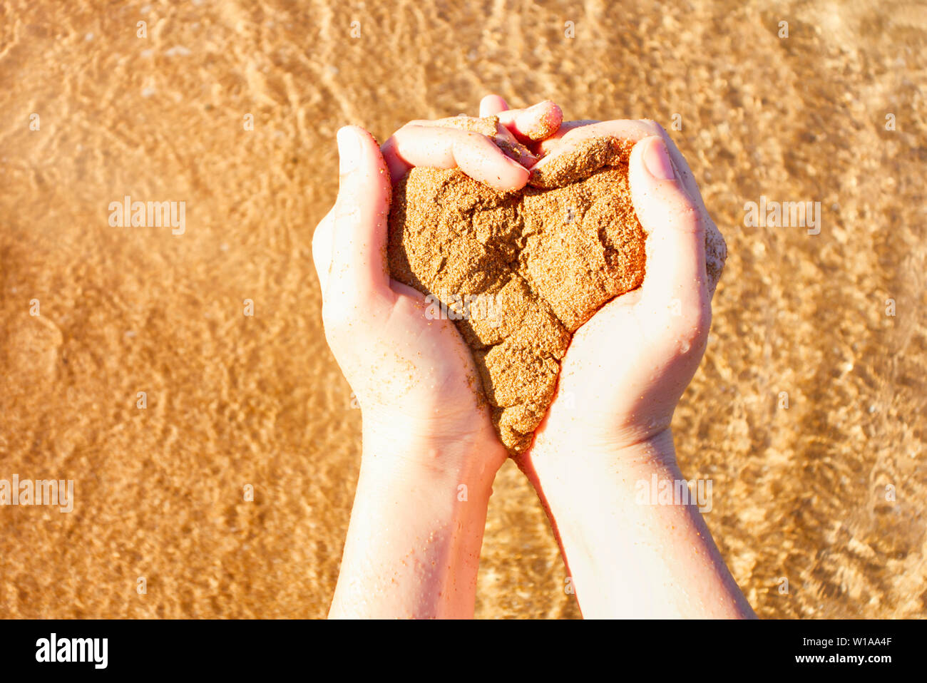 Handful of sand hand full of sand hi-res stock photography and images ...