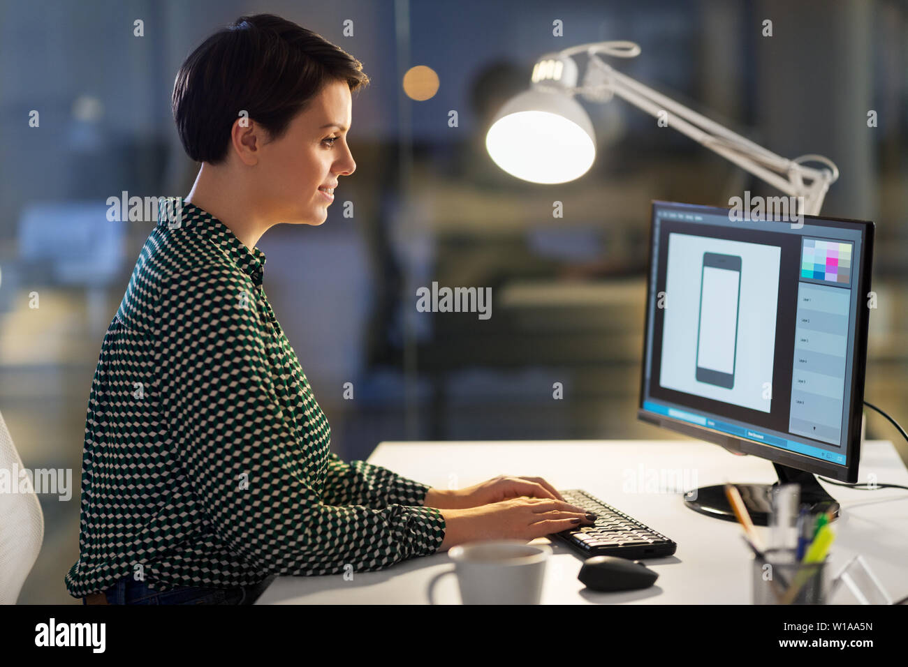 graphic designer with computer working at office Stock Photo - Alamy