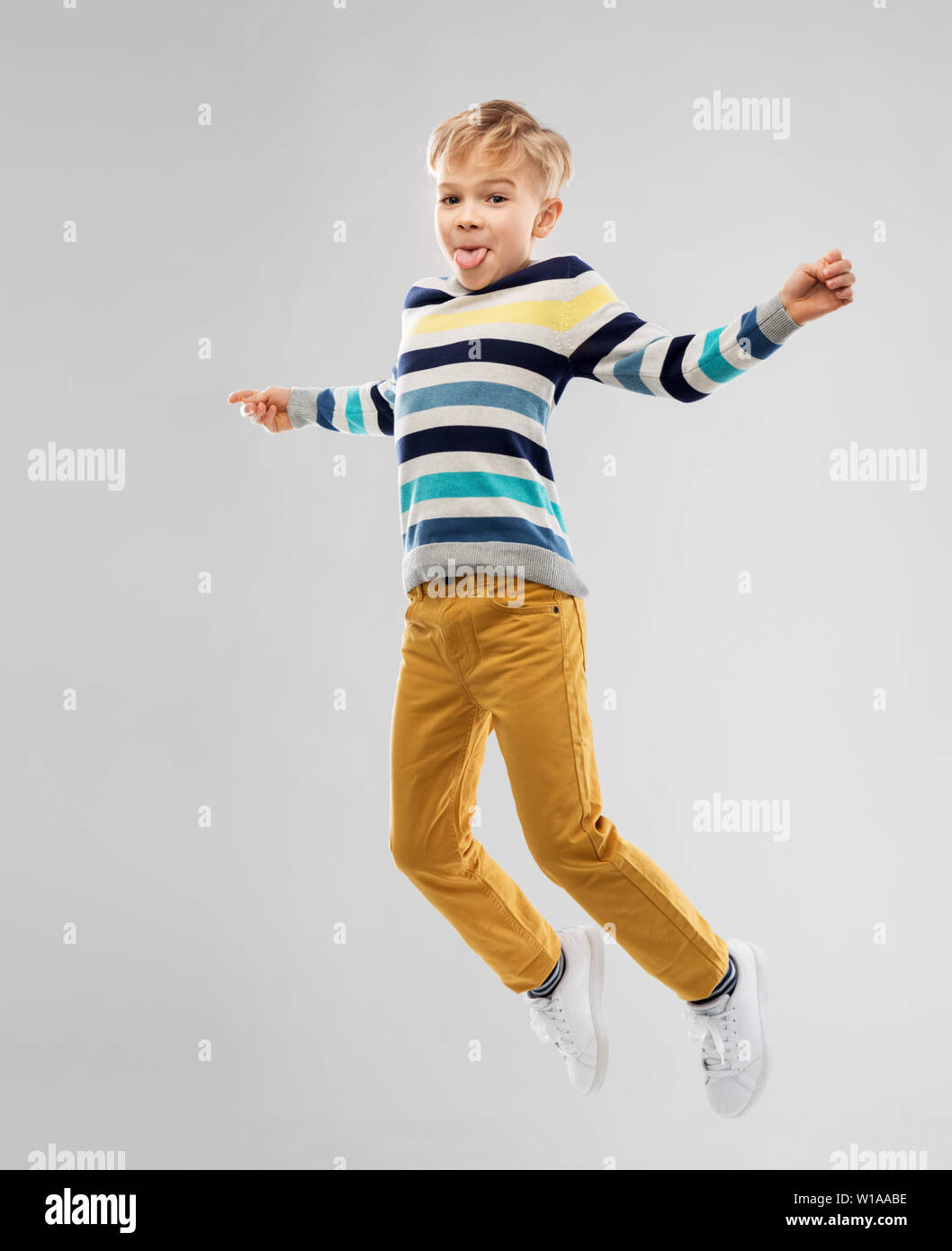happy little boy jumping and having fun Stock Photo - Alamy
