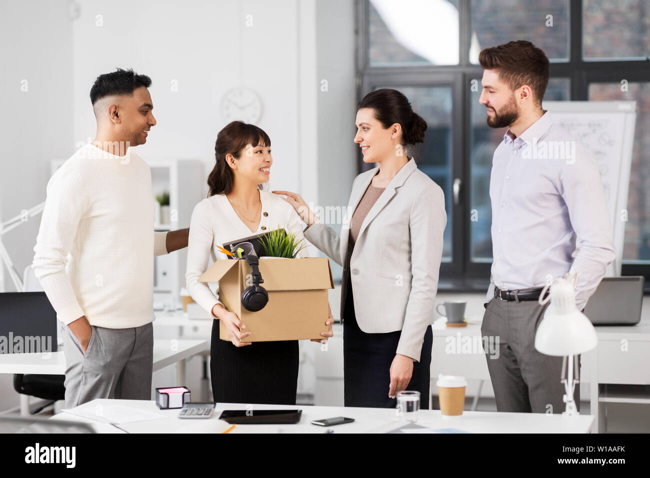 new female employee with colleagues at office Stock Photo - Alamy