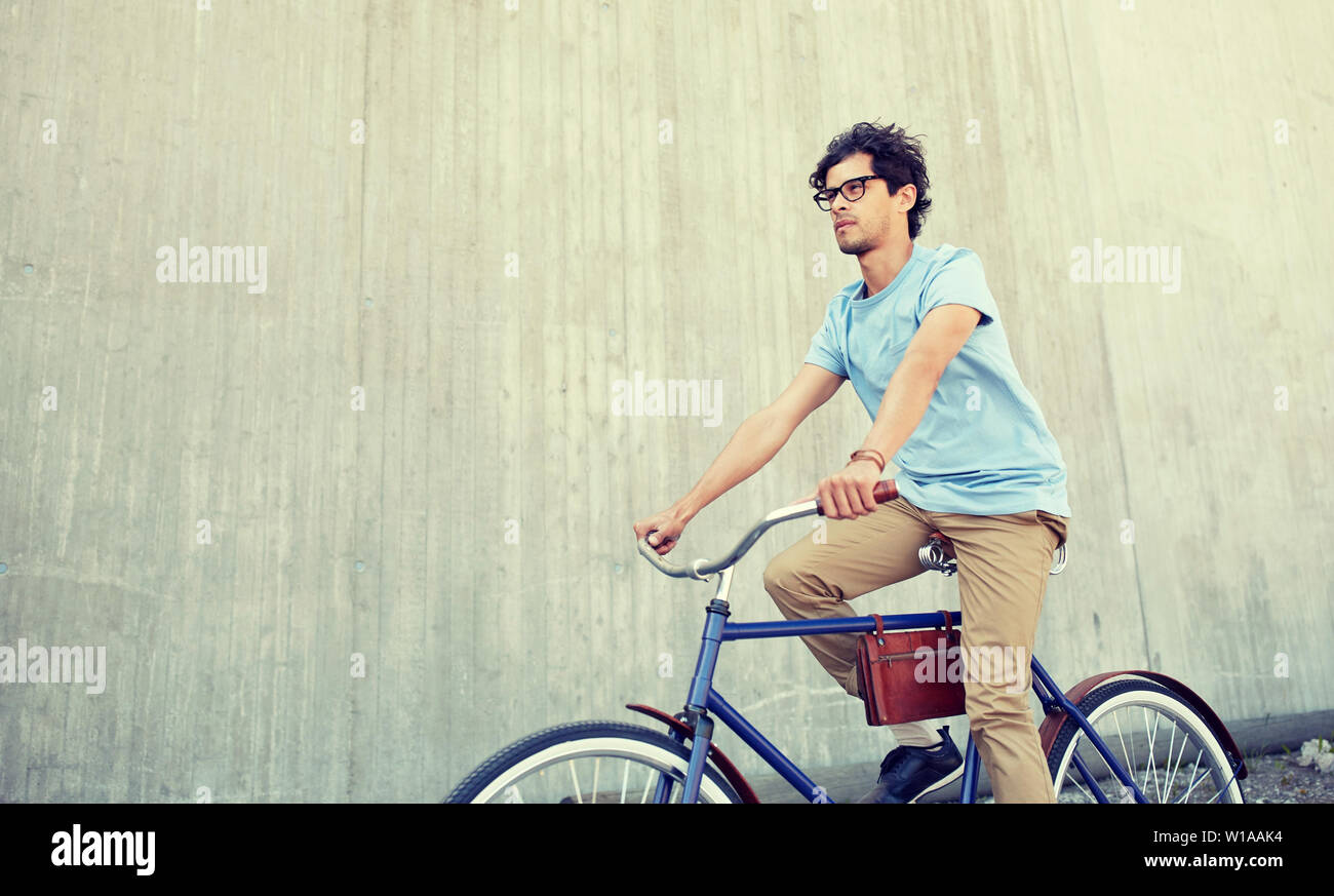 young hipster man riding fixed gear bike Stock Photo - Alamy