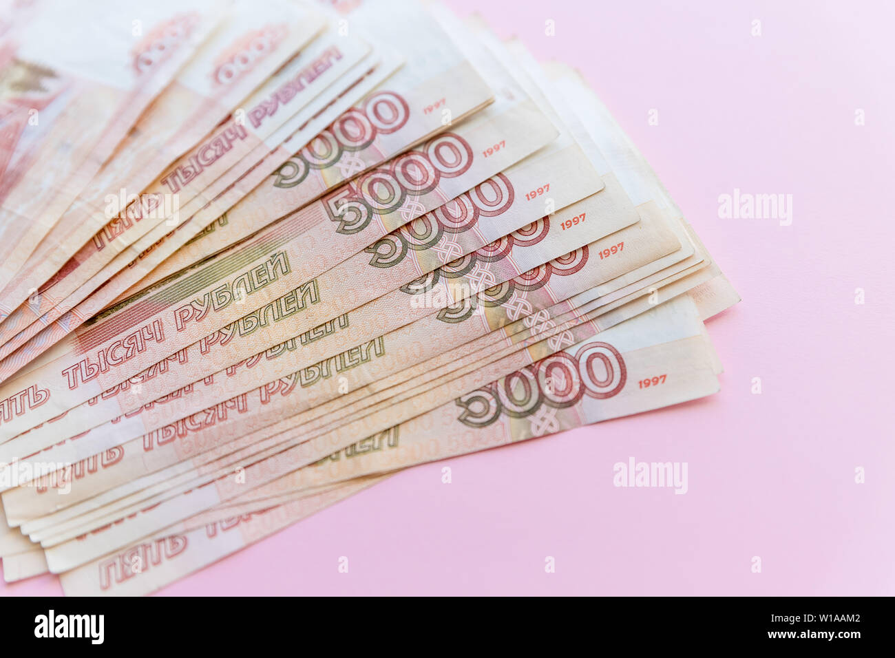 Russian rubles isolated on pink, packed stack of banknotes.Russian ...