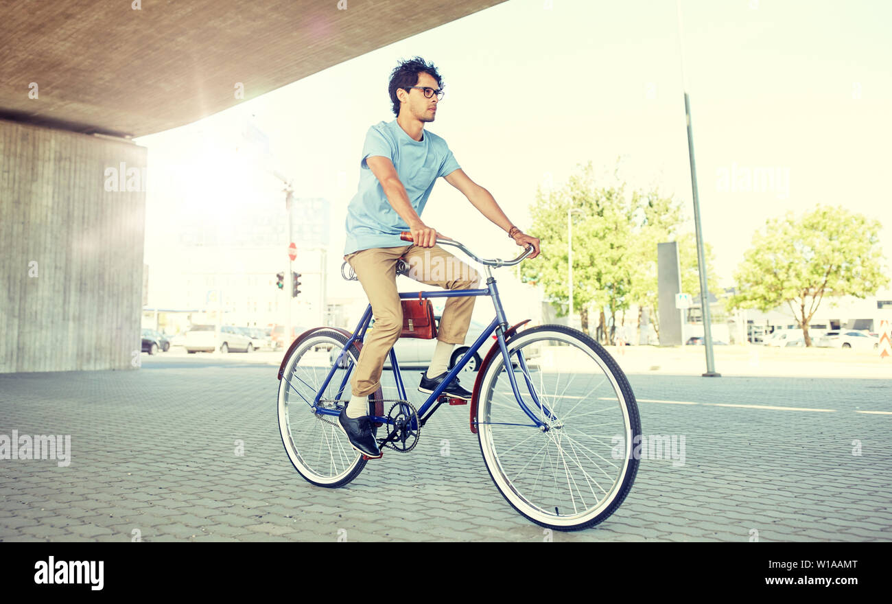 young hipster man riding fixed gear bike Stock Photo - Alamy