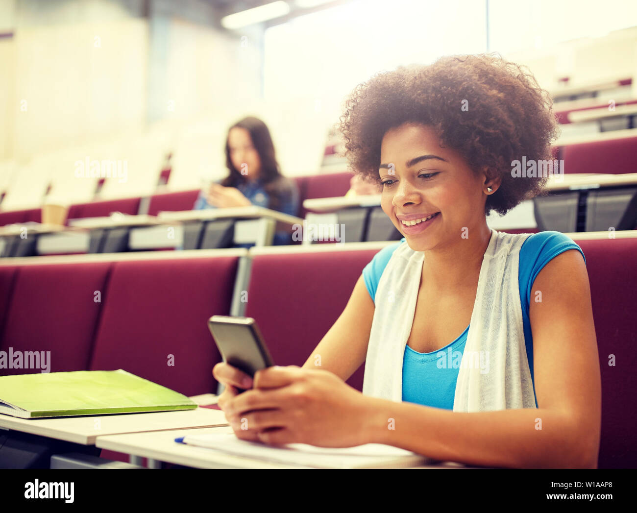 african student girl with smartphone at lecture Stock Photo - Alamy