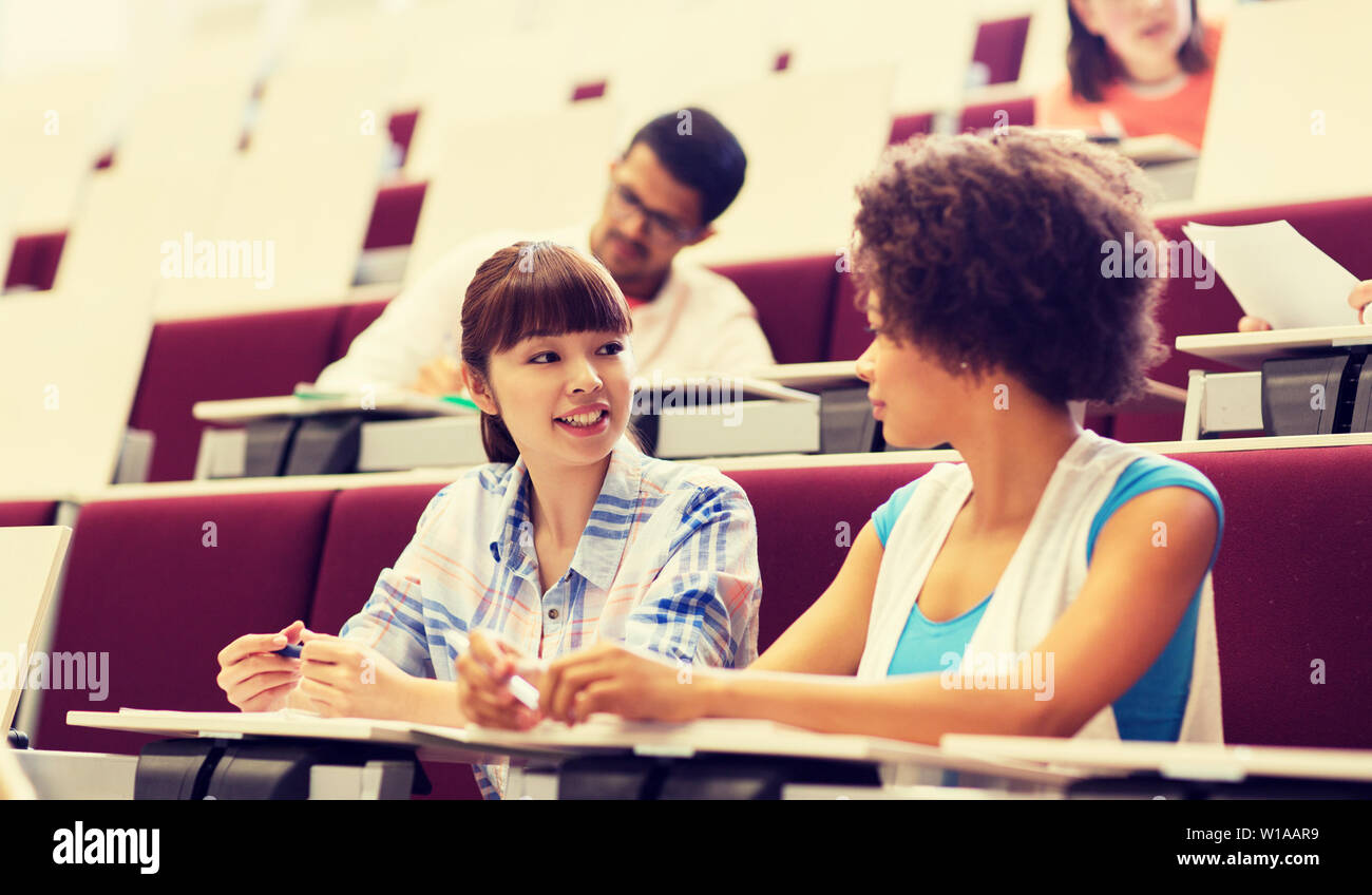 group of students talking in lecture hall Stock Photo - Alamy