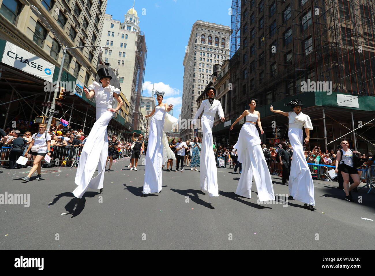NEW YORK, NEW YORK - JUNE 30: Performers entertain crowds during the ...