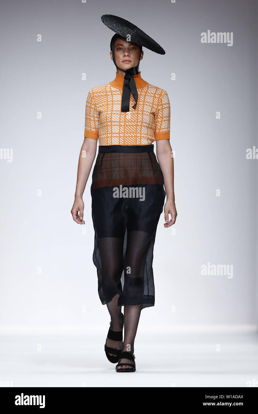 Berlin, Germany. 1st July, 2019. A model presents a creation of ...