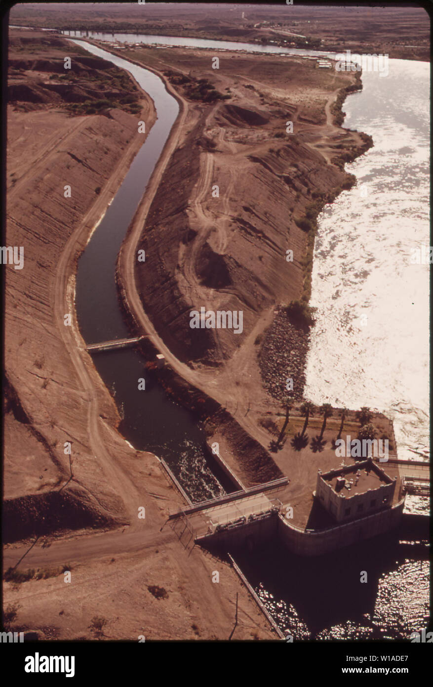 A DIVERSION DAM ON THE COLORADO RIVER. DIVERTED WATER (LEFT) FLOWS ...