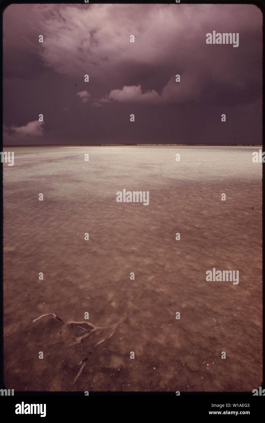 A STORMY SKY GIVES THE CAMERA A CLEAR VIEW OF THE CLOUDS OF SILT IN THE ...