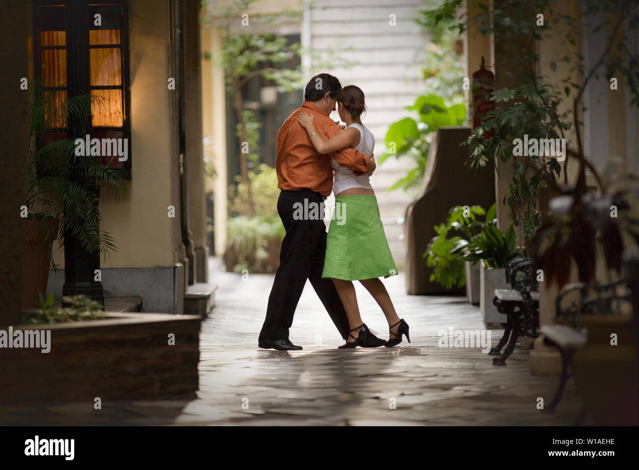 View of a couple dancing in a hallway Stock Photo - Alamy
