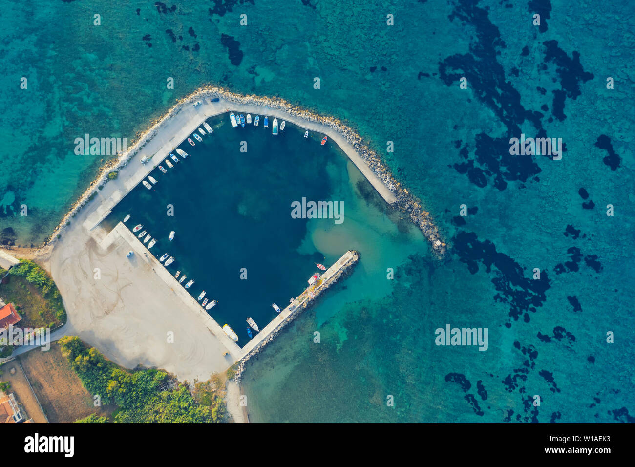 Aerial view of a bay port with boats on blue clear sea water Stock ...