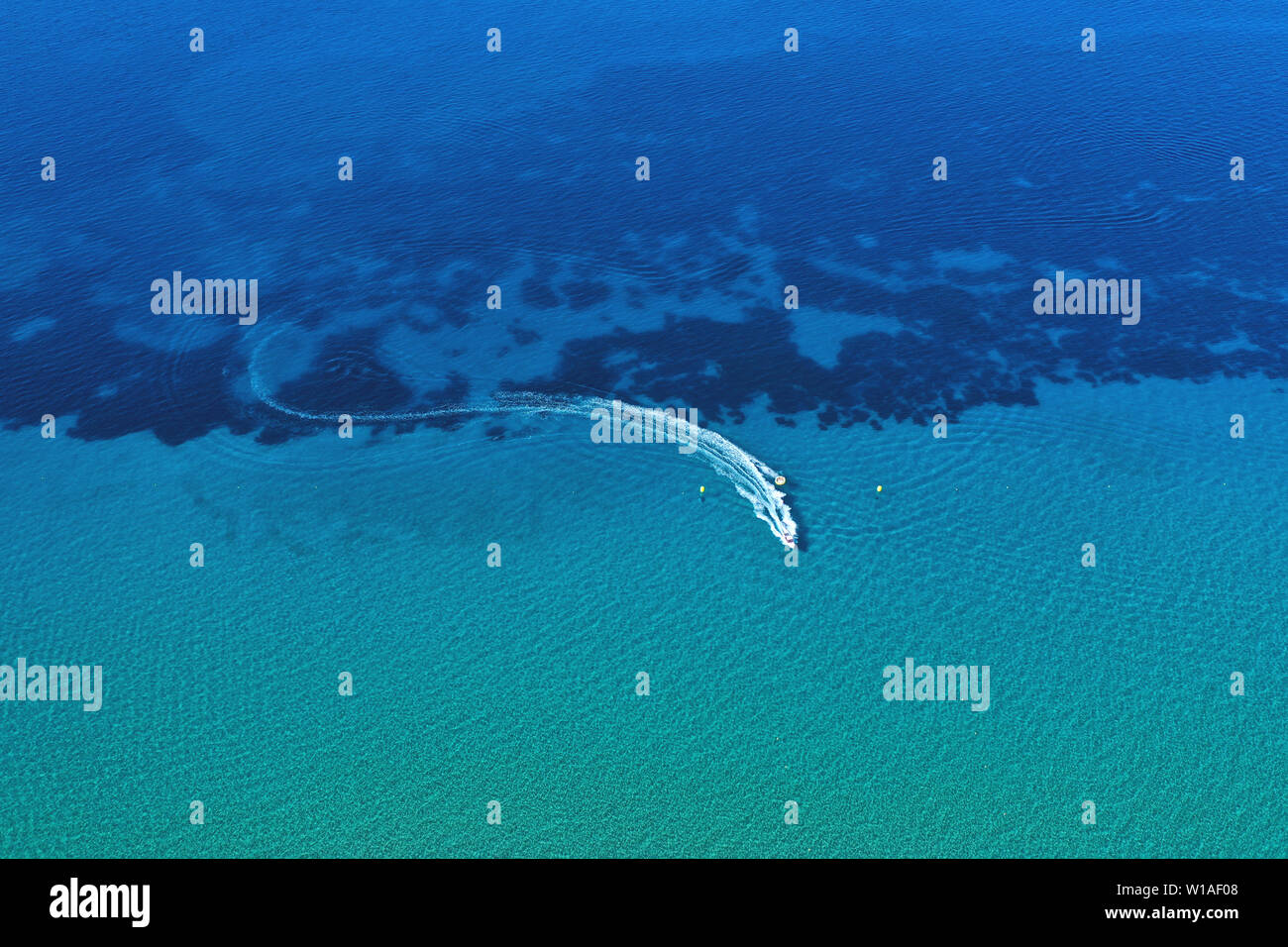 Aerial view of speed boat in motion. Water transportation and summer ...