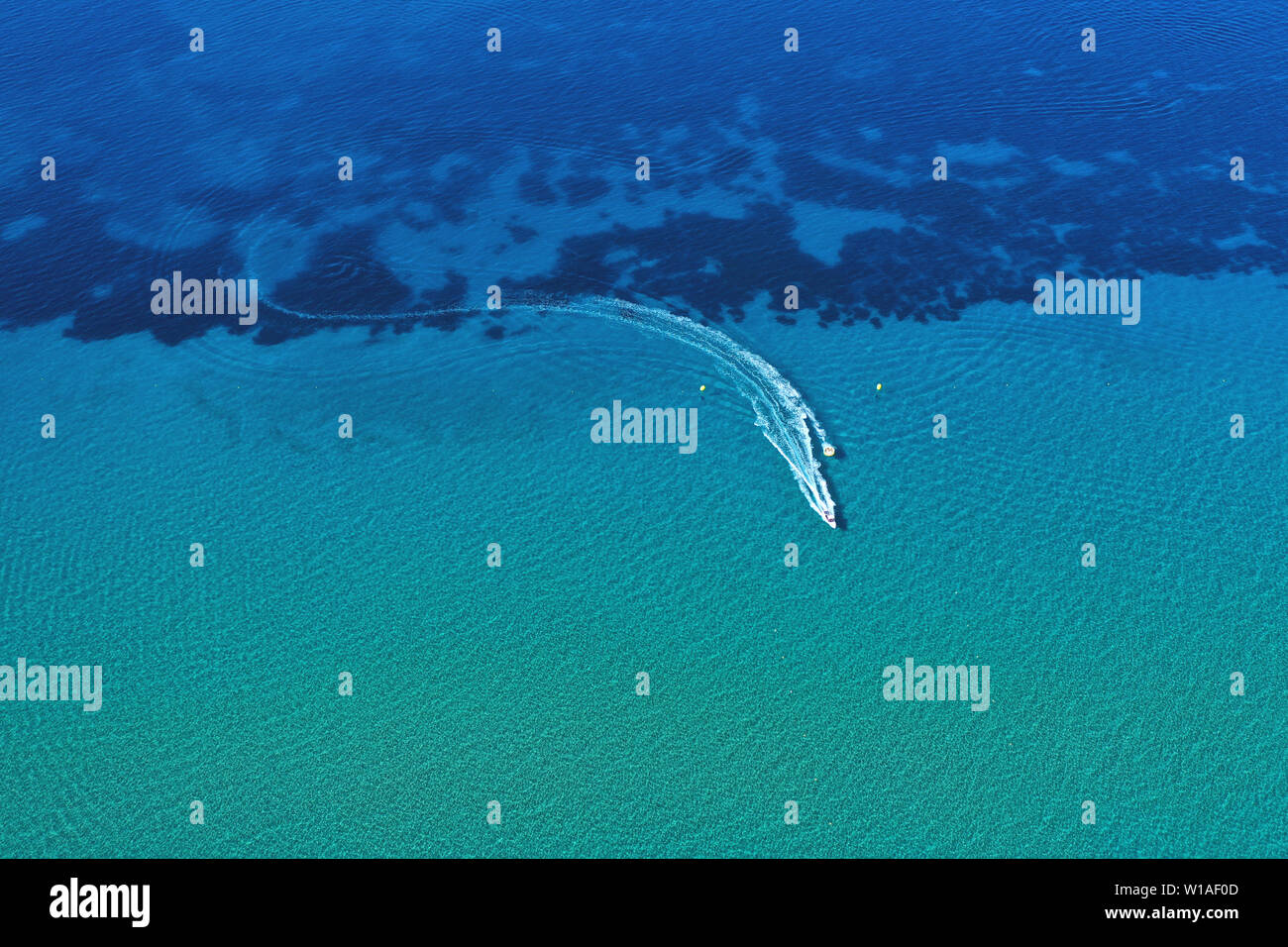 Aerial view of speed boat in motion. Water transportation and summer ...