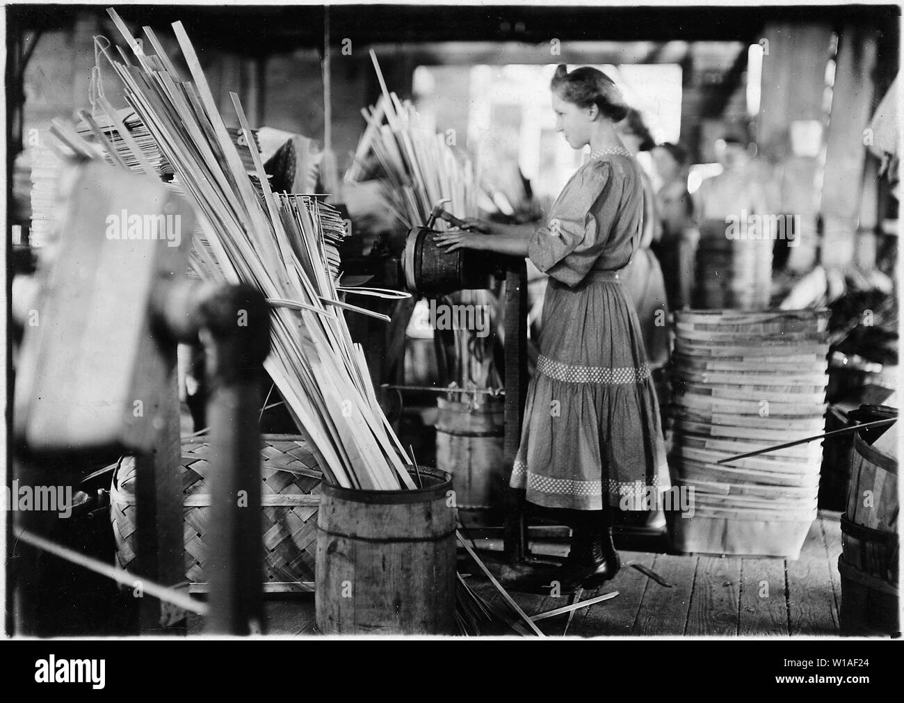 A basket factory. Girls making melon baskets. Evansville, Ind Stock ...