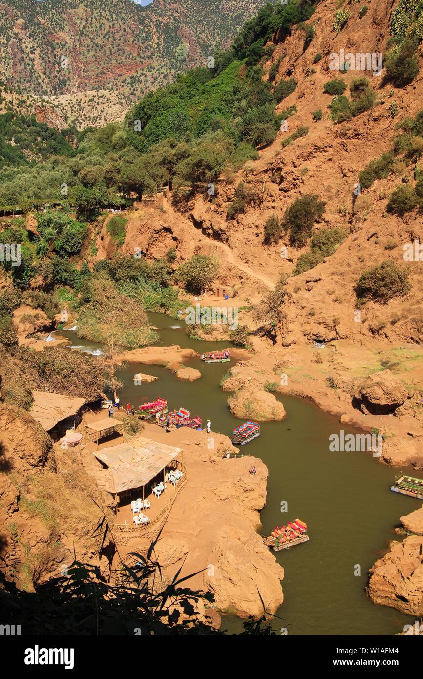 Panoramic view into isolated canyon with river, conifer trees and red ...