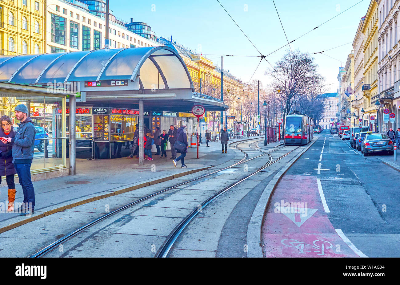 VIENNA, AUSTRIA - FEBRUARY 18, 2019: The large covered tram stop with ...