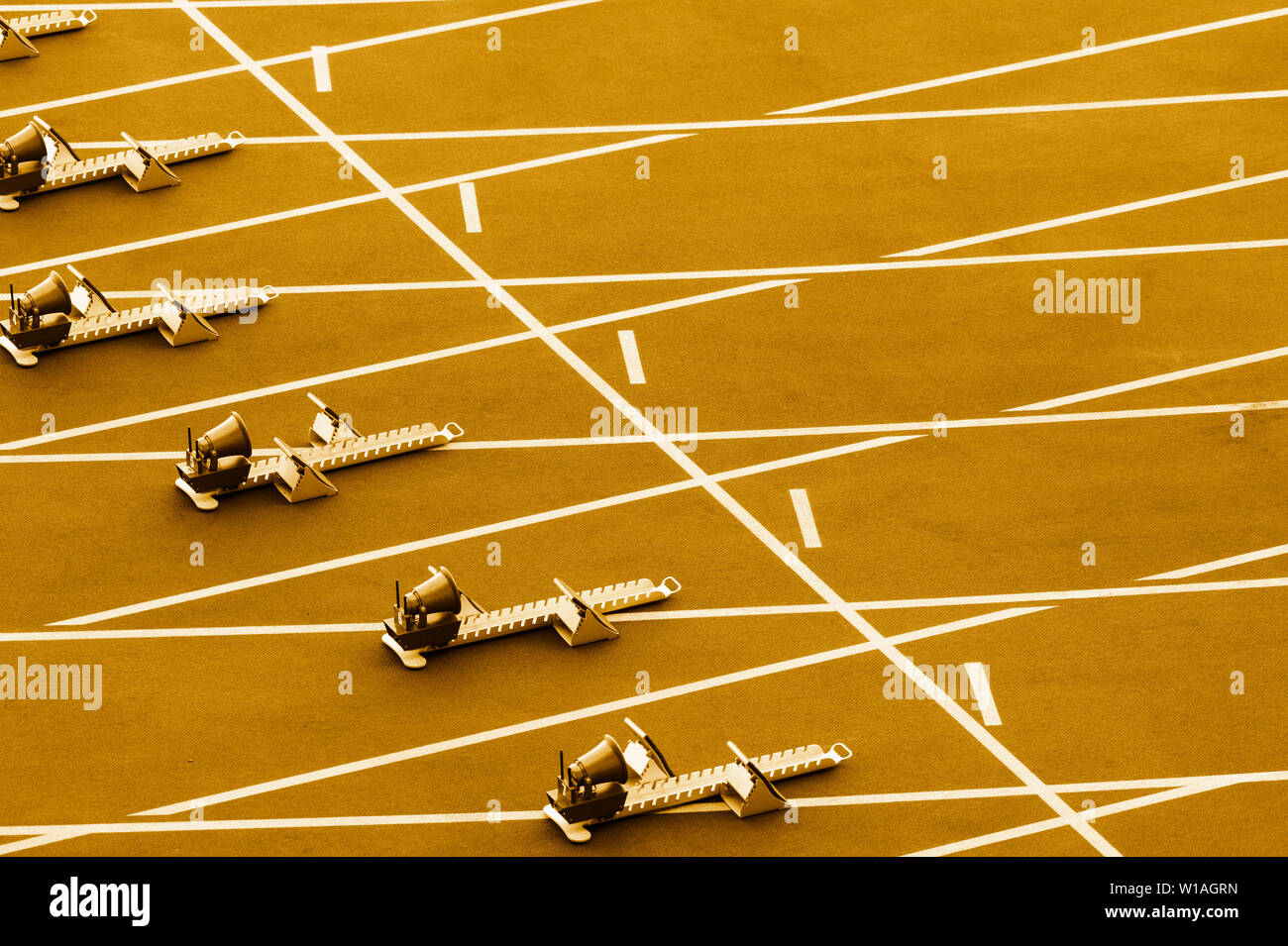 On starting block ready for sprint start. Yellow color filter Stock ...