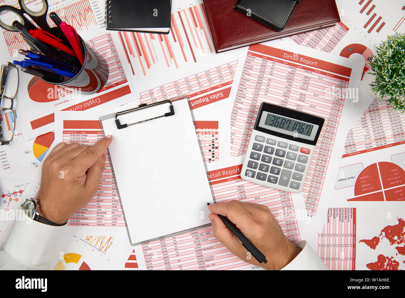 Business reports, blank paper sheet, data tables and charts - directly ...