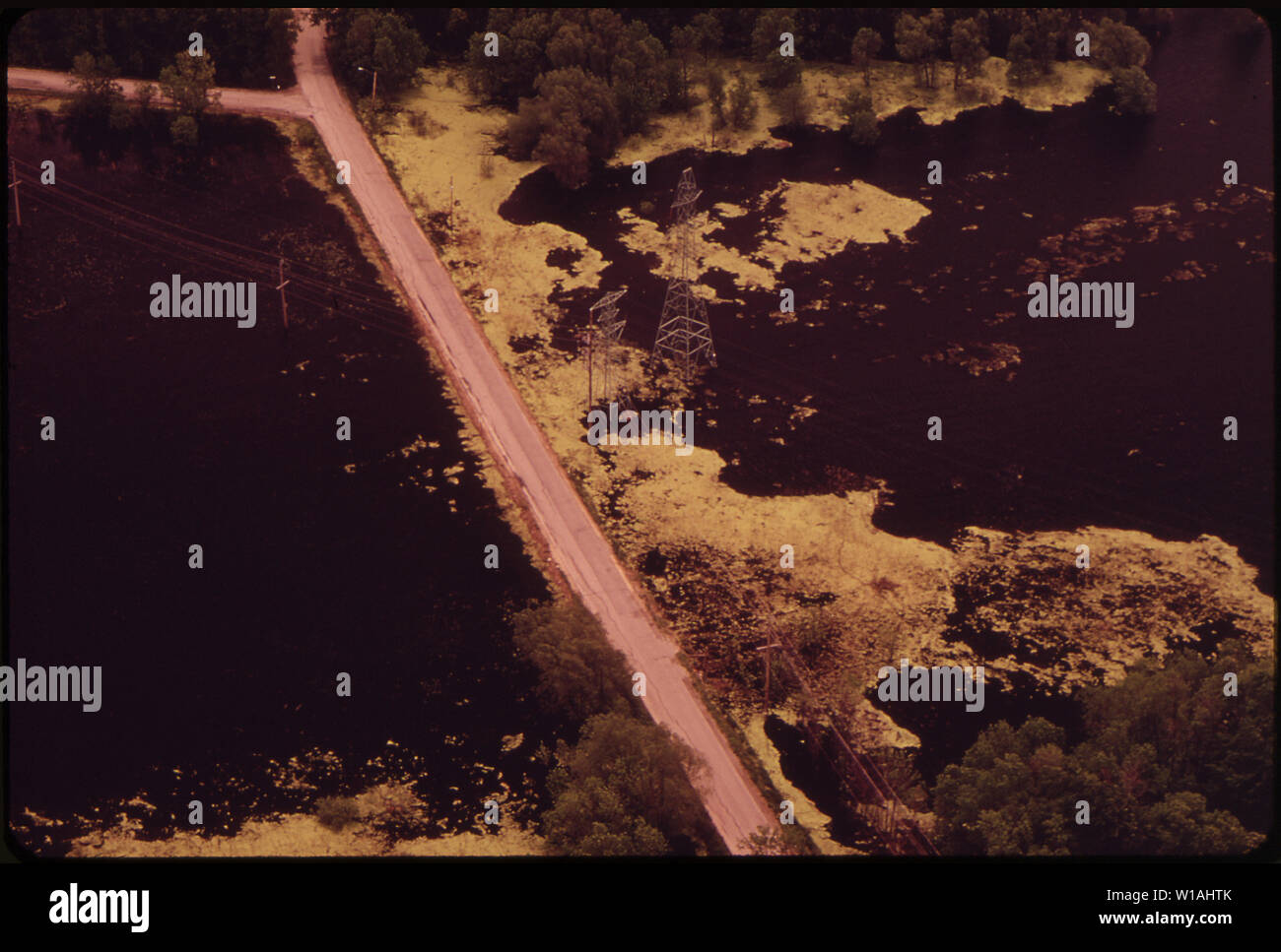 ALGAE COLLECT INSIDE BAYS OF THE FOX RIVER BETWEEN APPLETON AND GREEN ...