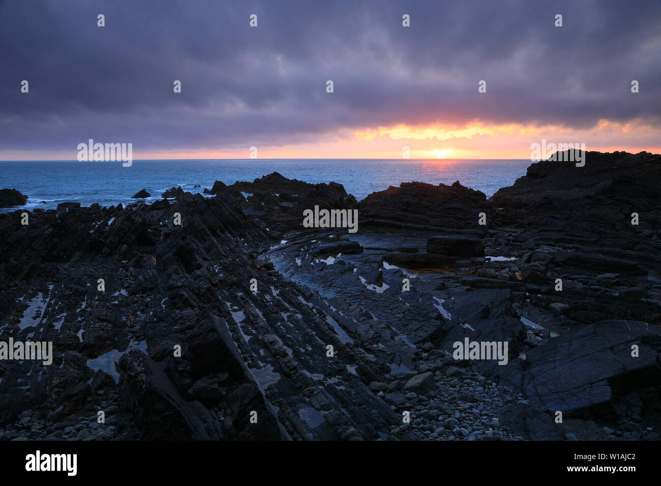 Hartland Quay sunset, North Devon, England, UK Stock Photo - Alamy