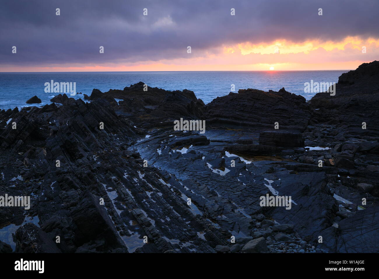 Hartland Quay sunset, North Devon, England, UK Stock Photo - Alamy