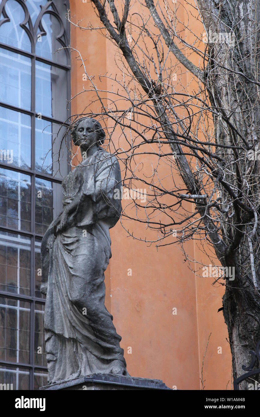 Female saint statue in the exterior garden area outside of Storkyrkan ...