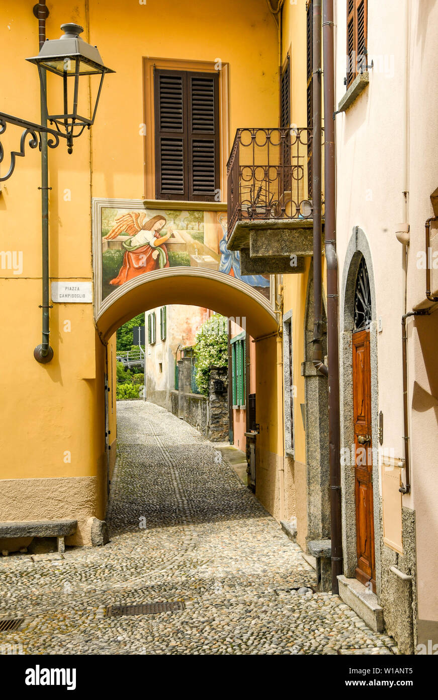 LAKE COMO, ITALY - JUNE 2019: Archway in a building in a village on the ...