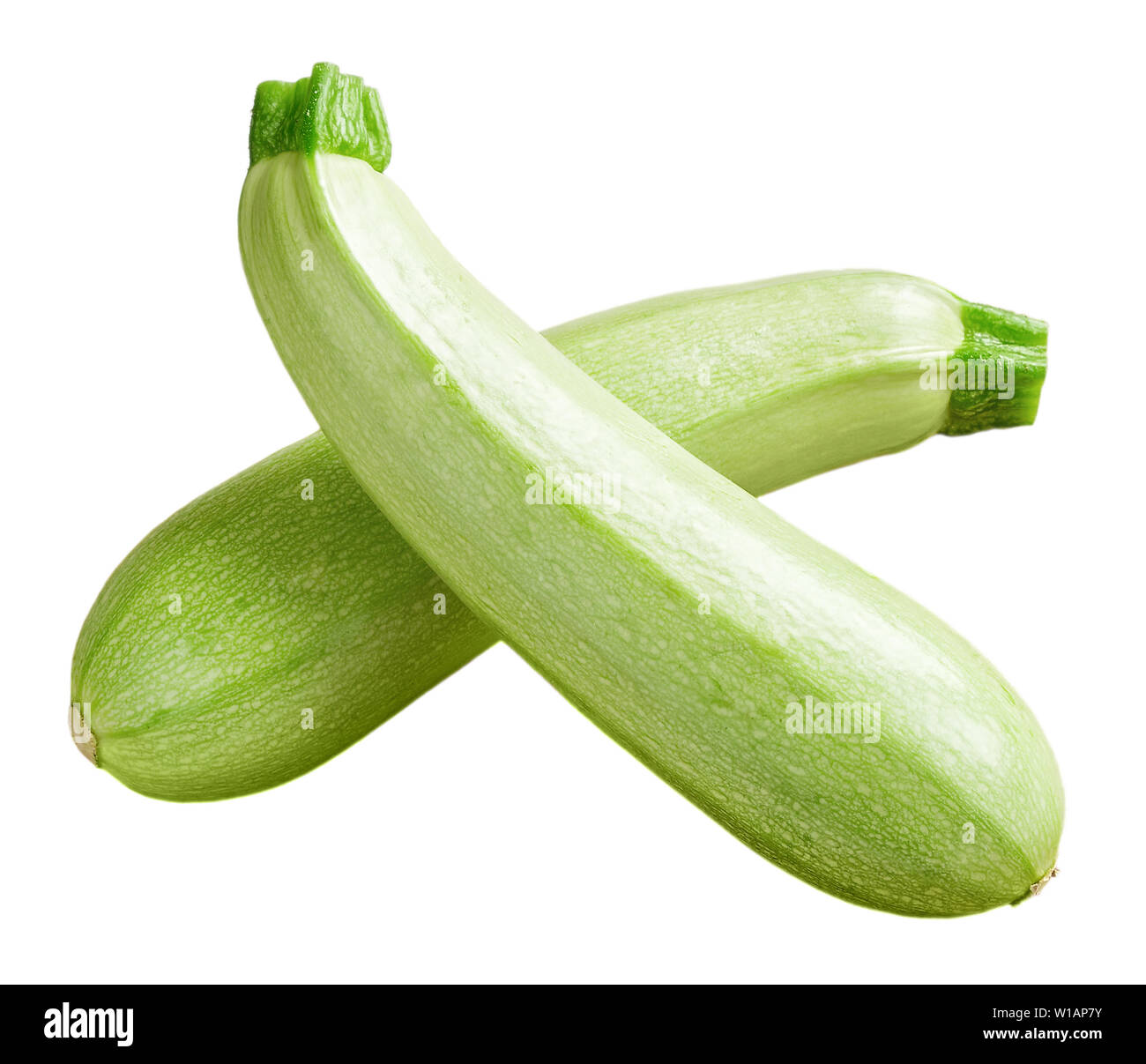 Two fresh green courgettes or zucchini criss-cross isolated on white ...
