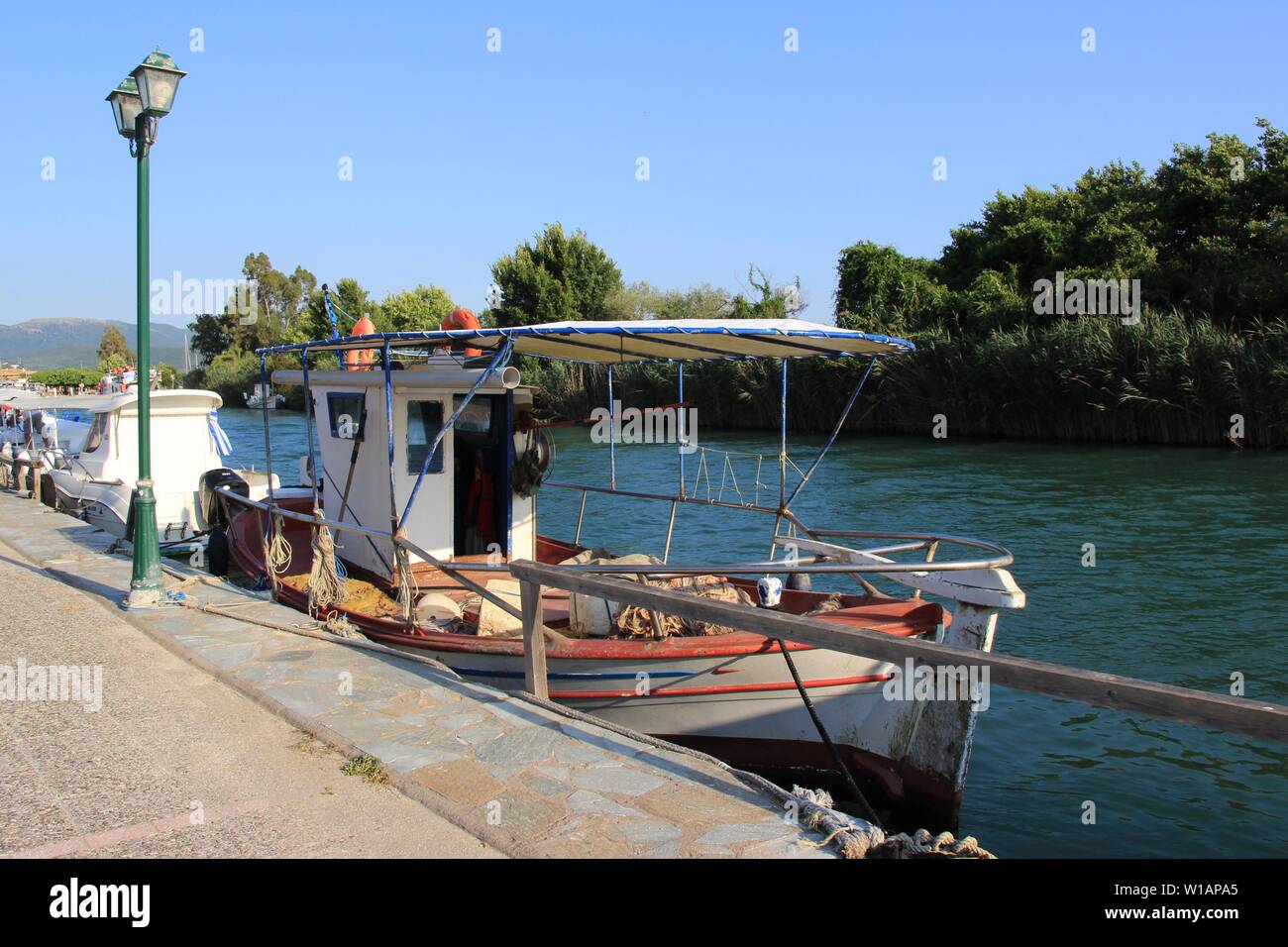 Traditional old fishing boats in a row at the river banks of Acheron ...