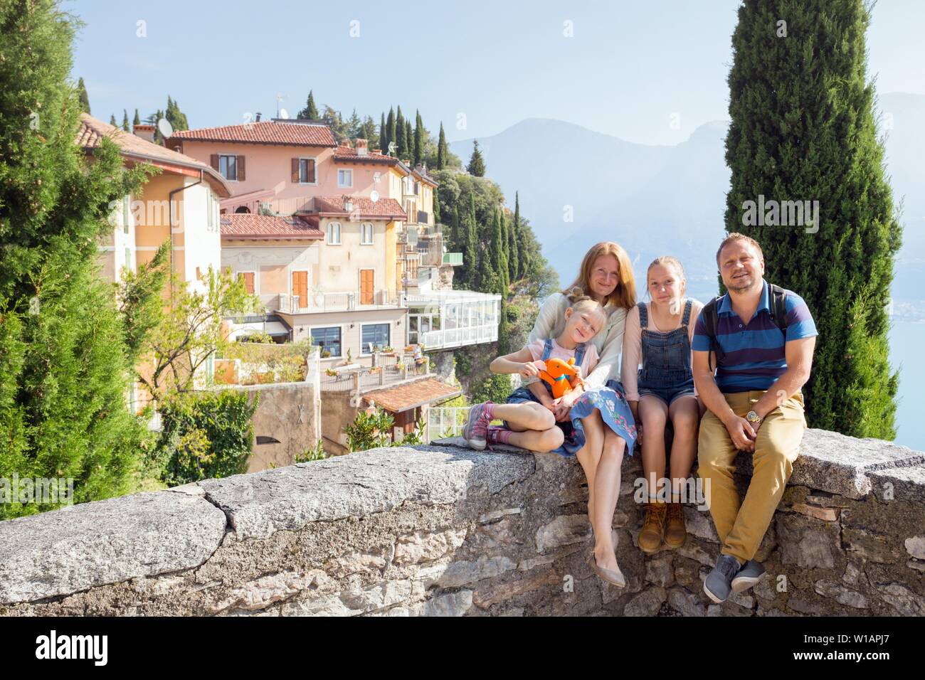 happy family and view of the famous terrace in a small town Tremosine ...