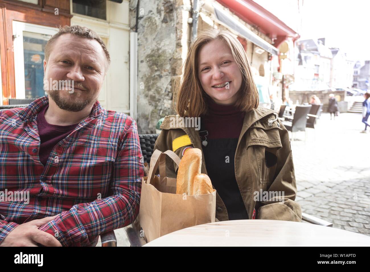 dad and daughter at the traditional french caffee. Morlaix, France ...