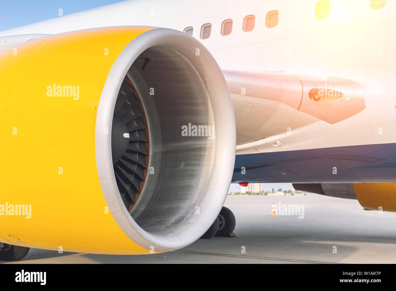 Close-up big commercial plane engine standing on airfiled after ...