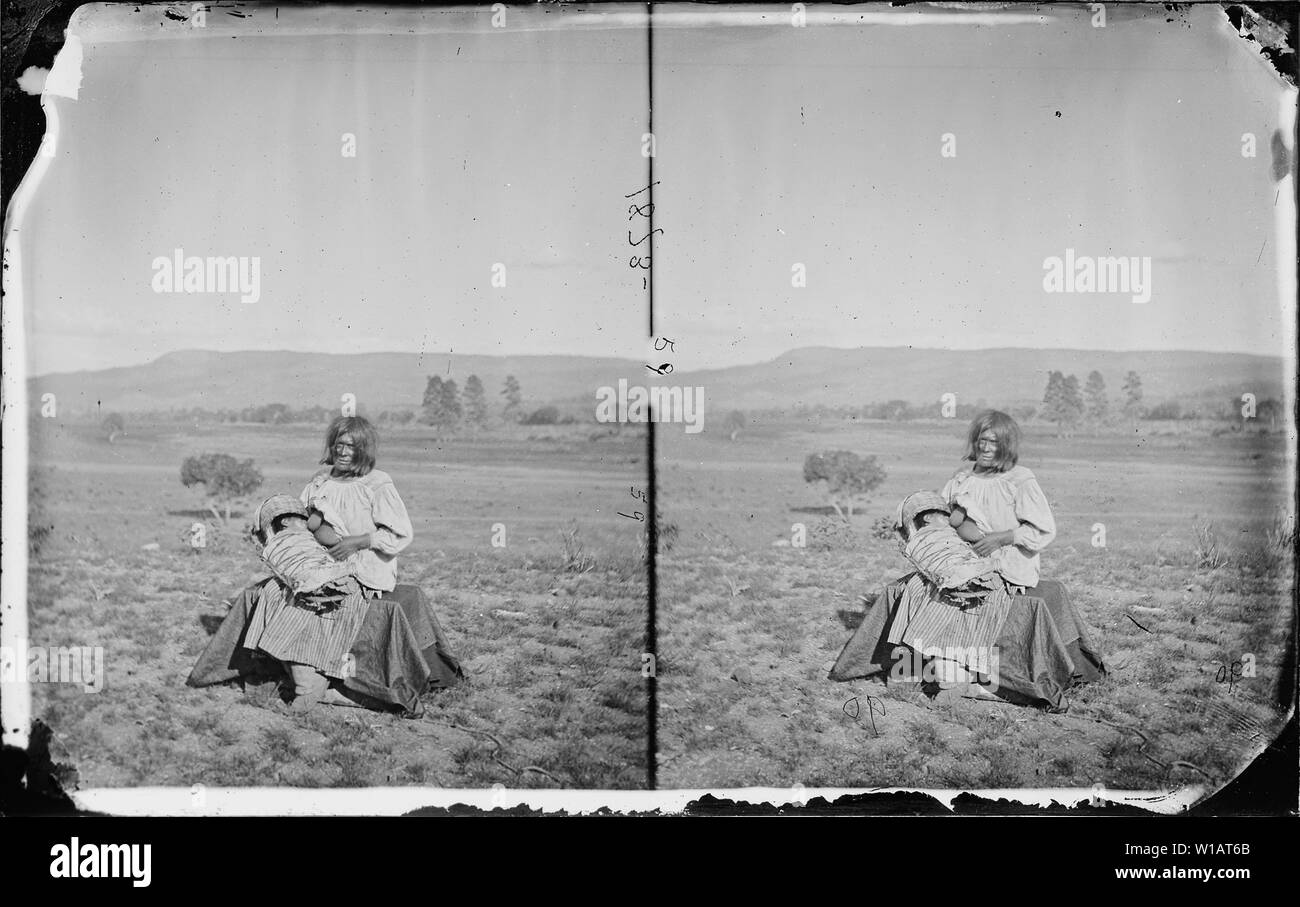 Apache squaw and child. 1873 Stock Photo - Alamy