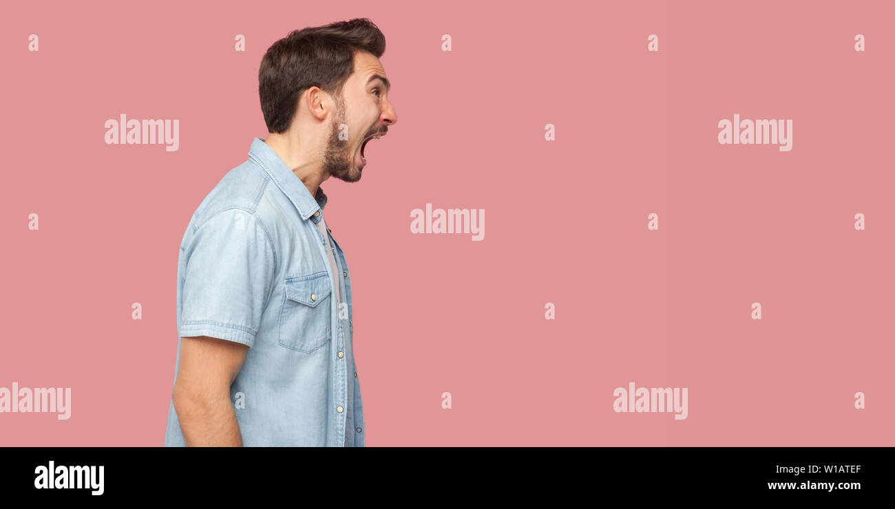 Side profile young man screaming hi-res stock photography and images ...